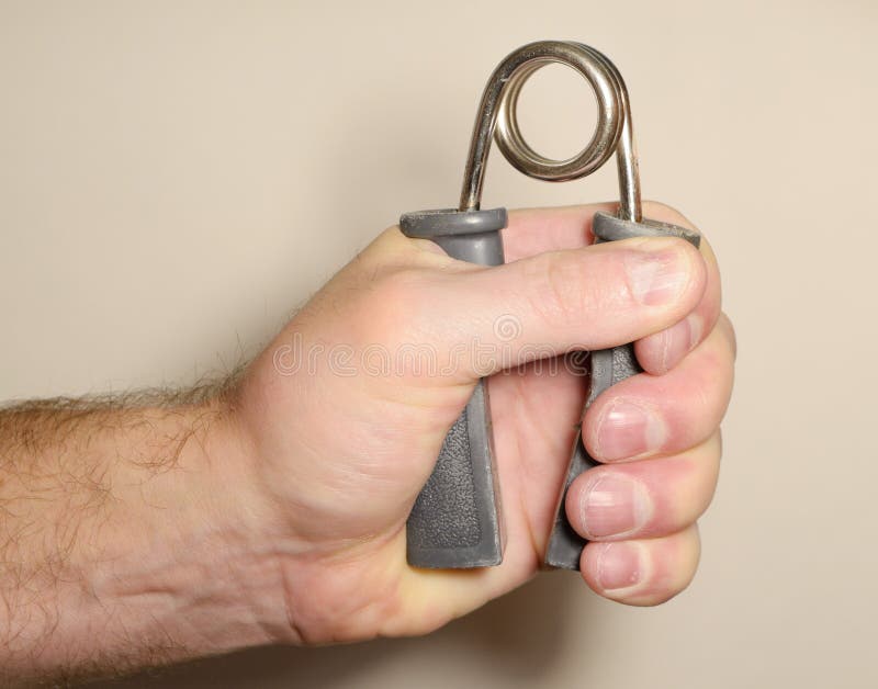 Power expander in hand stock photo. Image of rubber - 133279380