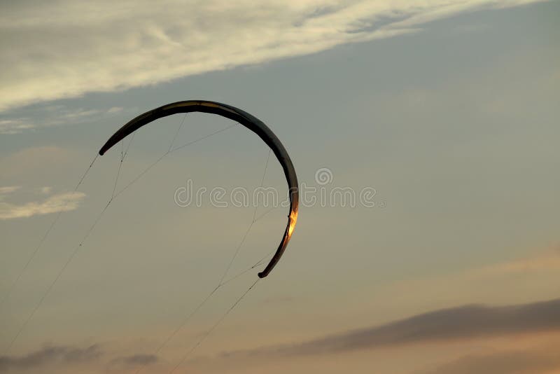 A Power Kite Surfer Swimming in the Lagoon Against the Backdrop of a ...