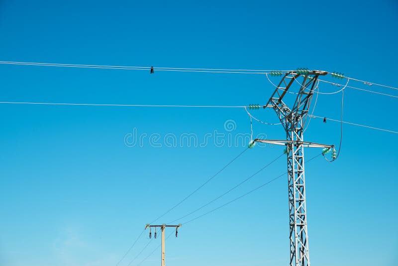 Power line and blue sky stock photo. Image of industrial - 318515550