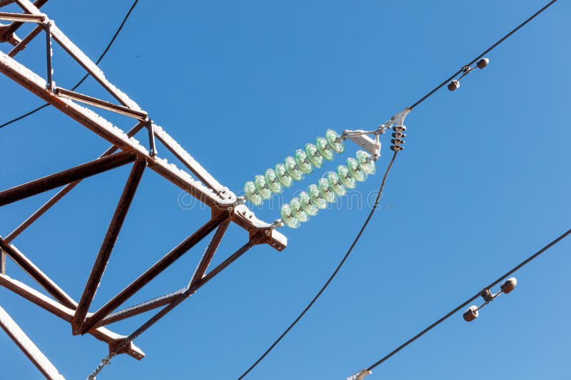 A Power Line with a Green and White Insulator Stock Image - Image of ...