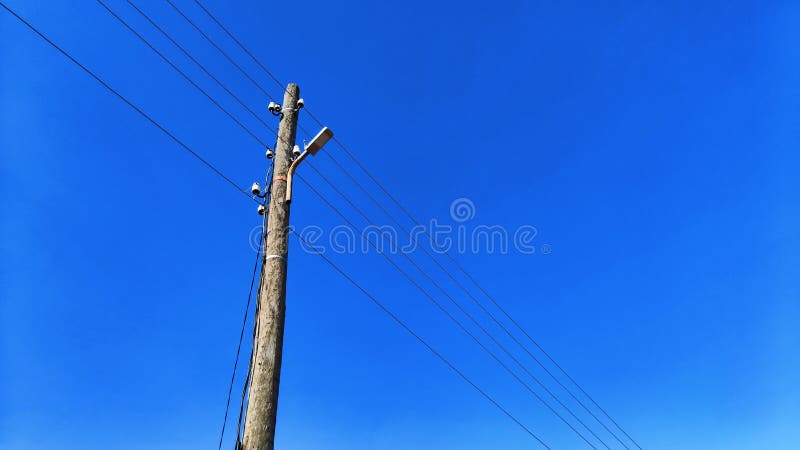 Power Line Pole on a Blue Sky Background Stock Photo - Image of ...