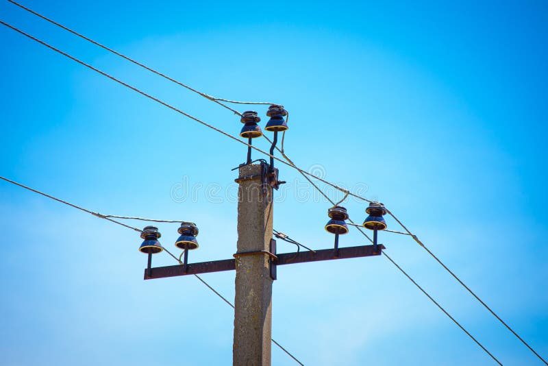 A Power Line Pole in Close-up Against a Blue Sky Background Stock Photo ...
