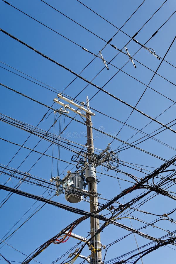 A Power Line Pole with Wires Hanging from it. Stock Image - Image of ...