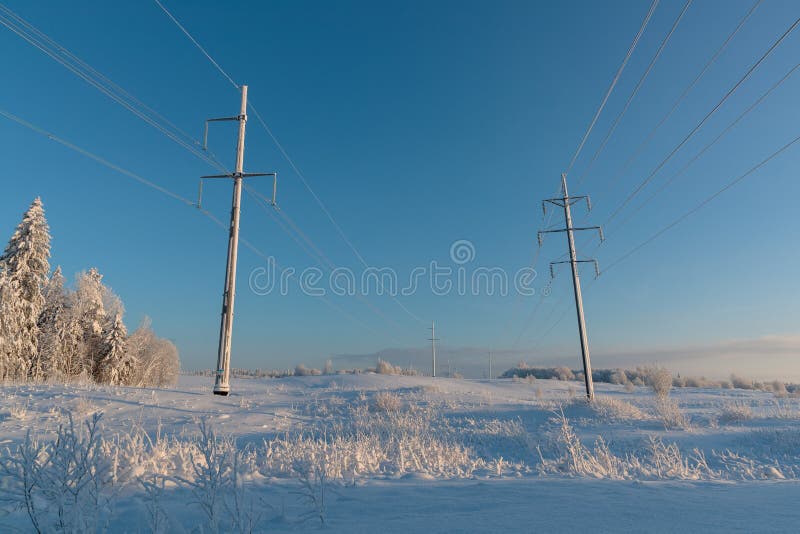 Power line poles in winter stock image. Image of winter - 220951185