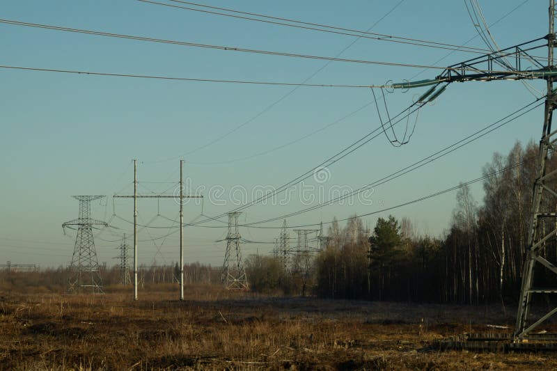 Power Line Posts. High Voltage Tower on the Sky Background Stock Photo ...