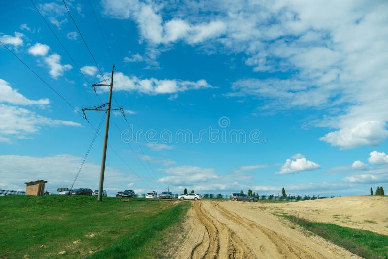 The Power Line Runs Along an Empty Dirt Road. Sandy Impassable Road ...