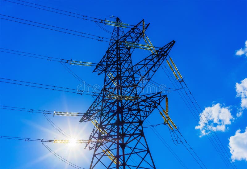 Power Line Silhouette Against the Blue Sky with Rays of Sunlight. Stock ...