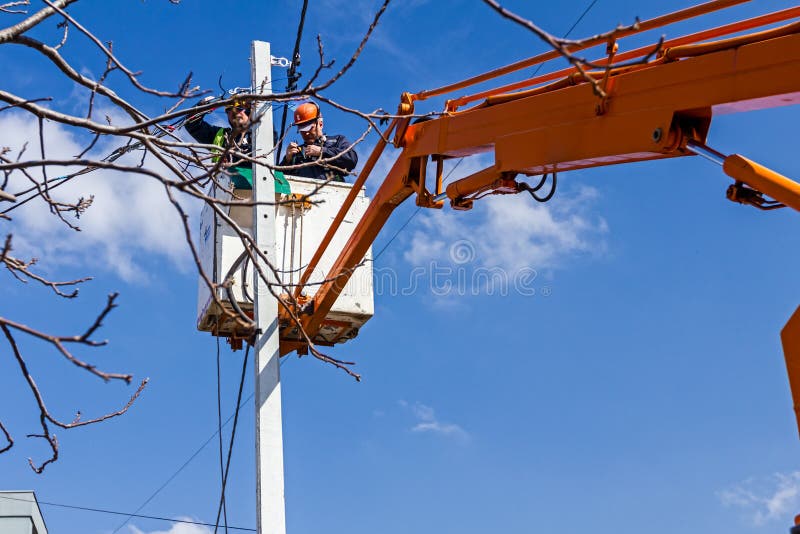 Power Line Team at Work on a Pole Stock Image - Image of elevator ...