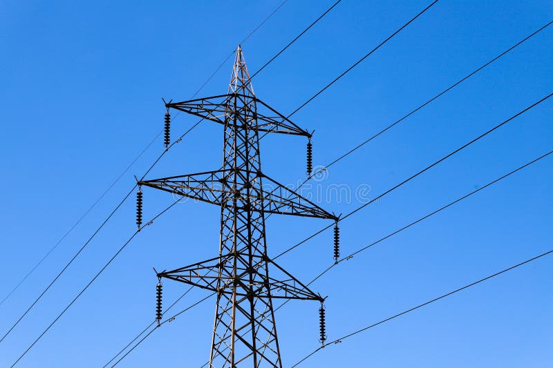 A Power Line Tower with a Blue Sky in the Background Stock Image ...