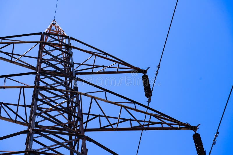 A Power Line Tower with a Blue Sky in the Background Stock Image ...