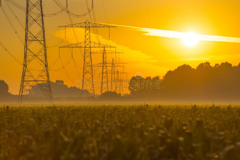 Power Line in a Yellow Sky at Sunrise Stock Photo - Image of ...