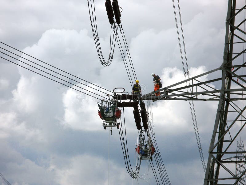 Linemen Working On Powerline Stock Photo - Image of danger, technology ...