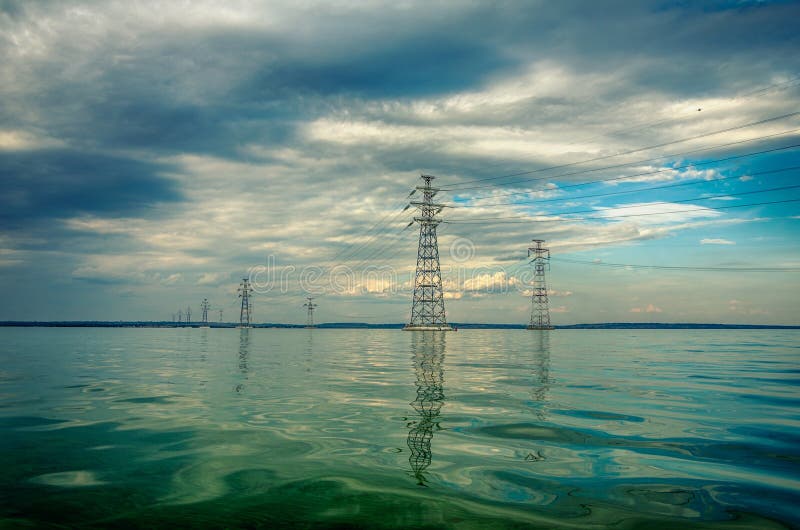 Power Lines Across the River Reflected in the Water Stock Image - Image ...