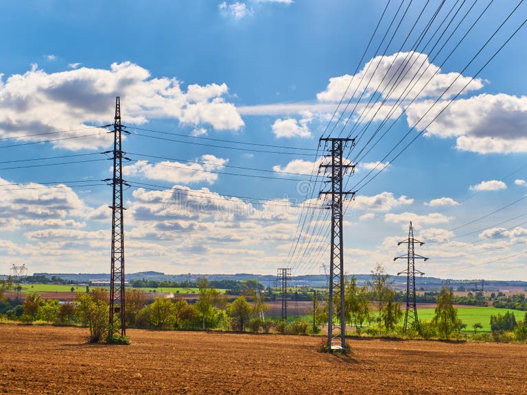 Power lines in fields stock photo. Image of electric - 127518938