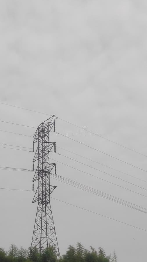 Power Lines in Cloudy Sky. Power Lines and High Voltage Cables. Stock ...