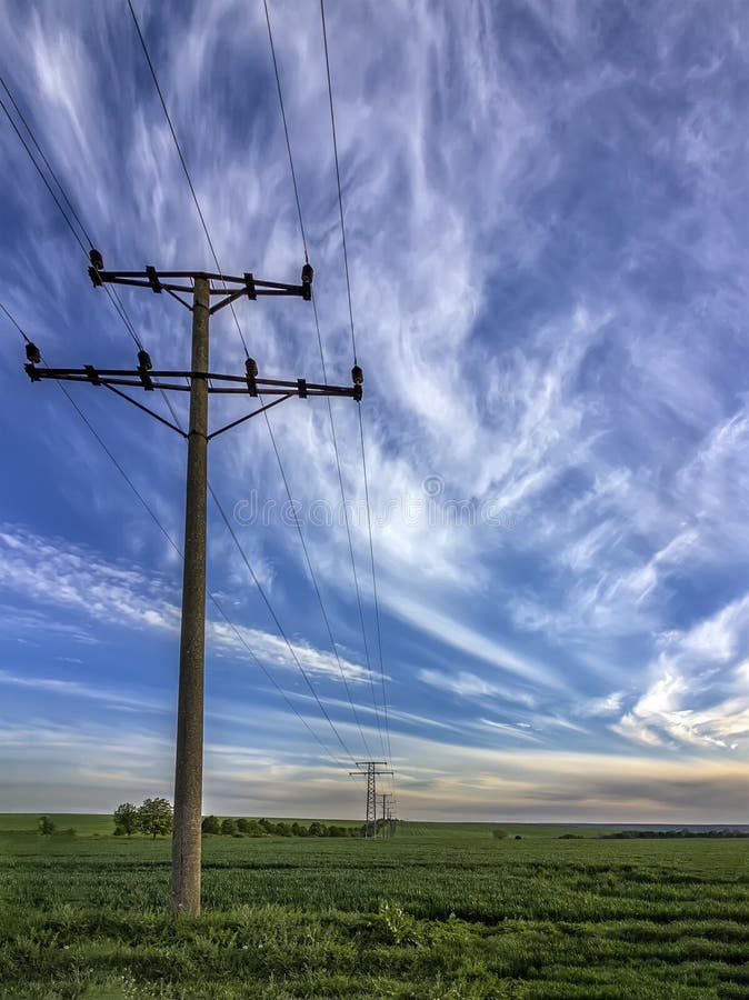 Power lines on the field stock image. Image of nature - 129520377