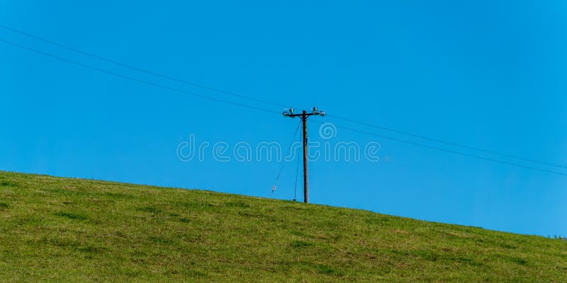 A Power Lines in a Field. Minimalistic Landscape, Electric Post on ...