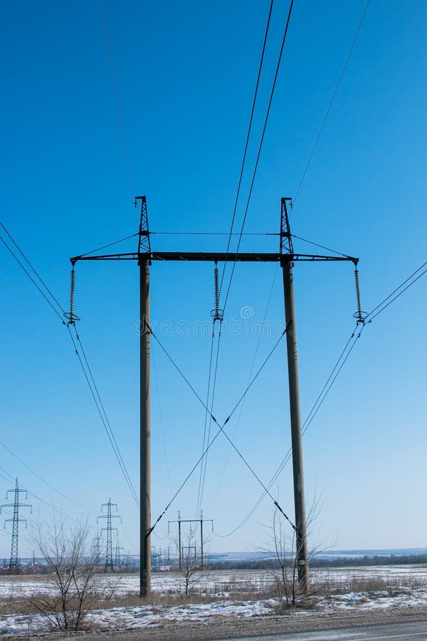 High Voltage Power Line Against the Blue Sky Stock Photo - Image of ...