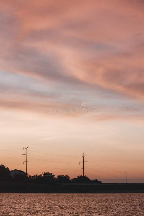 Power Lines on the Lake at Sunset Stock Image - Image of sunset, cloud ...