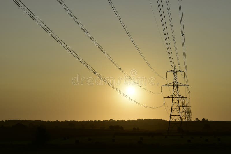 Power Lines Leading To National Grid Pylons at Sunrise. Editorial Image ...