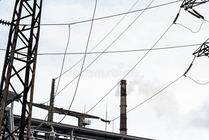 Power Lines and a Pipe with Smoke Stock Photo - Image of metal ...