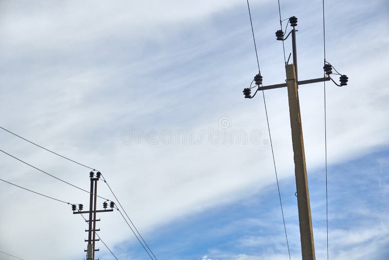 Power Lines, Poles and Poles among the Blue Sky and Clouds. Wires ...