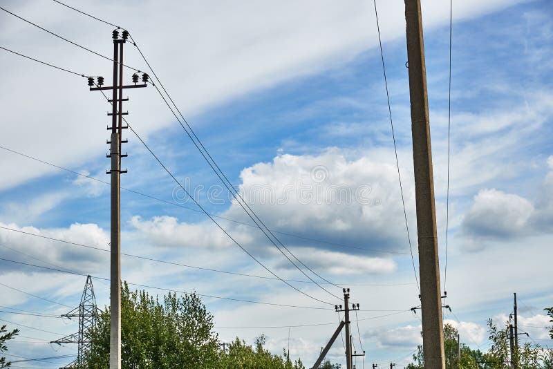 Power Lines, Poles and Poles among the Blue Sky and Clouds. Wires ...