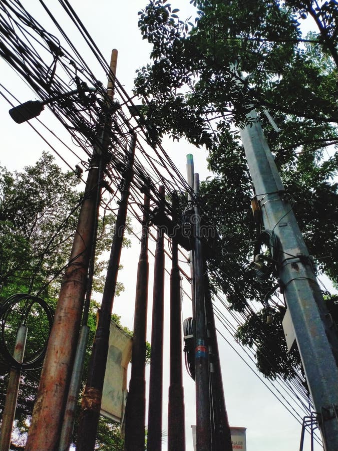 Power Lines on the Side of the Road Stock Photo - Image of bridge, road ...
