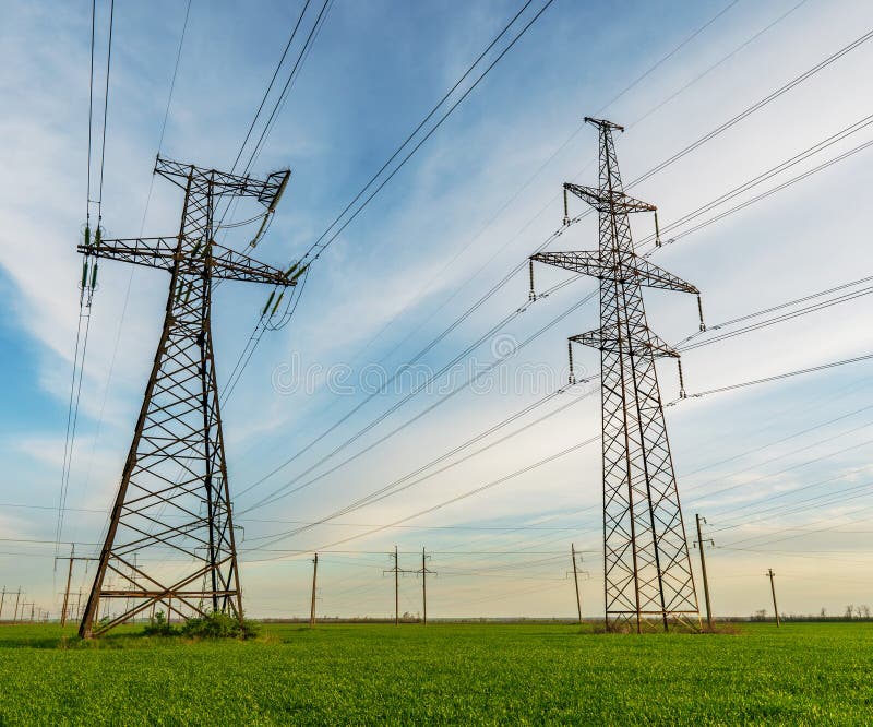 Power Lines in the Spring in a Green Wheat Field Stock Photo - Image of ...