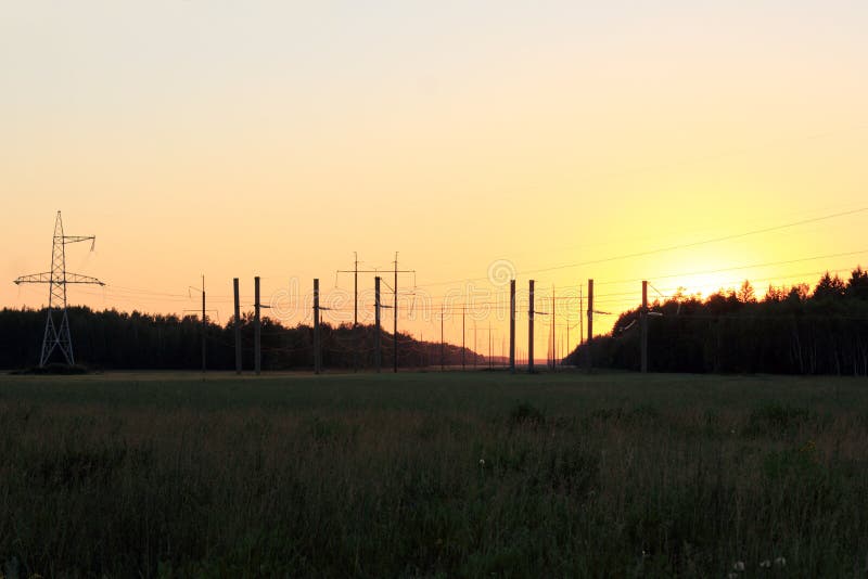 Power lines at sunset stock photo. Image of backgrounds - 84086320