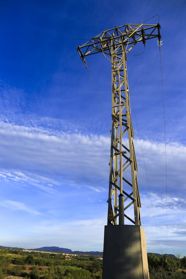 Power Lines Tower Under Blue Sky in the Countryside Stock Photo - Image ...