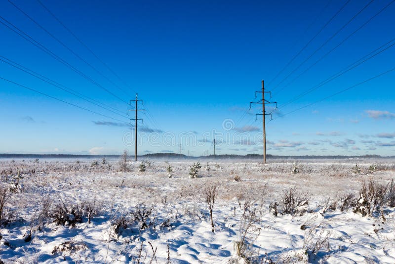Power Lines in Winter Snow Field Stock Photo - Image of frost, order ...