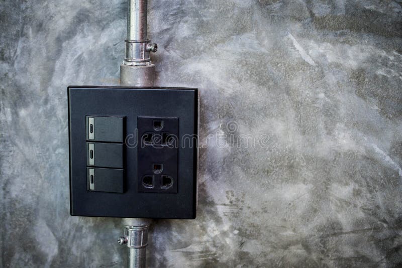 Plug The Power Outlet And The Power Switch On The Cement Wall Stock ...
