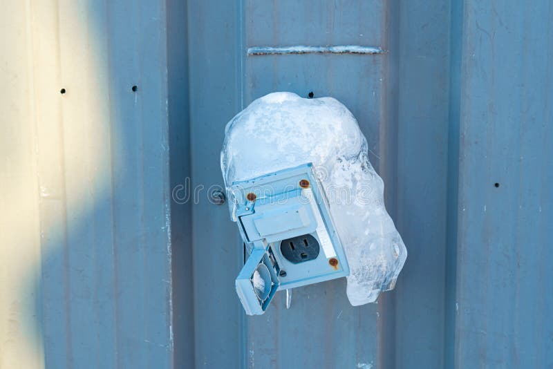 Power Outlet Covered in Winter Ice Stock Photo - Image of covered ...