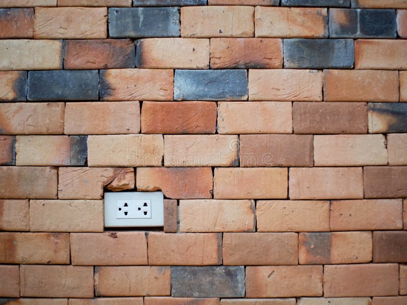 Power plug and red brick stock image. Image of home - 215746917