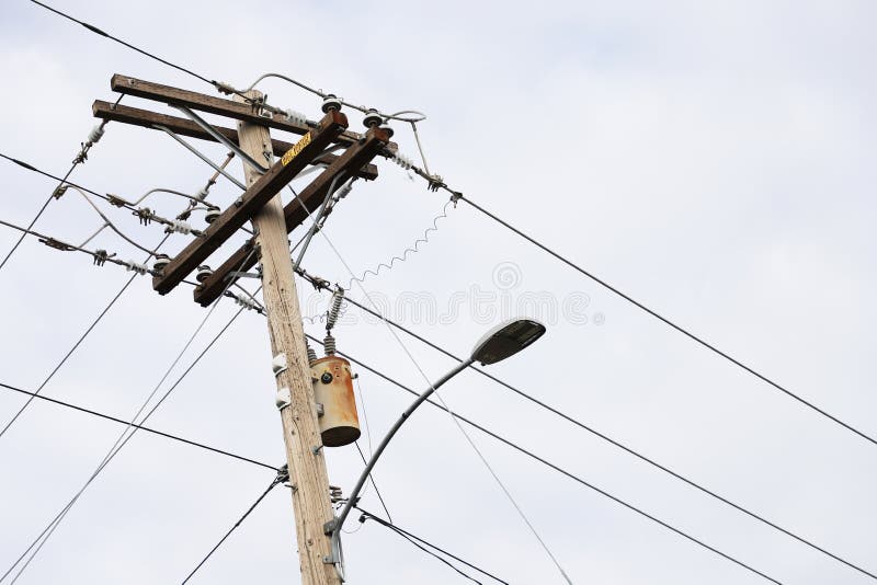 Power Pole with Cables Over Clouded Sky Stock Photo - Image of clouded ...