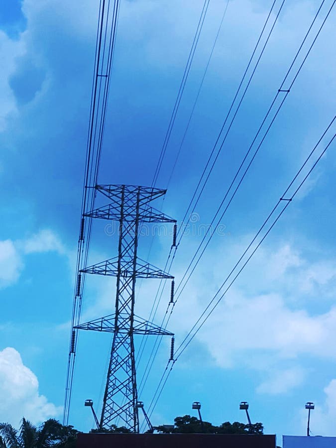 Power Pole and Electrical Wires Against a Blue Sky Stock Photo - Image ...