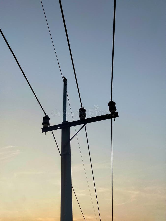 The Power Pole Has Electrical Cables Hanging Above it Stock Image ...