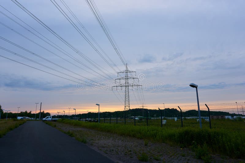Power pole in a sunset stock photo. Image of distribution - 126961964