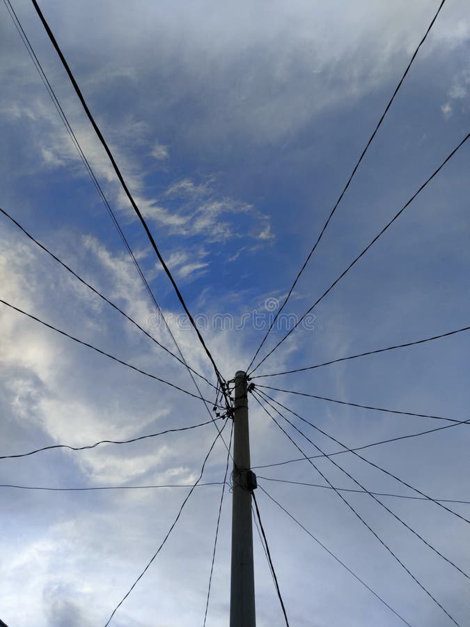 The Power Pole with the Wires Across it and the Blue Sky Stock Image ...