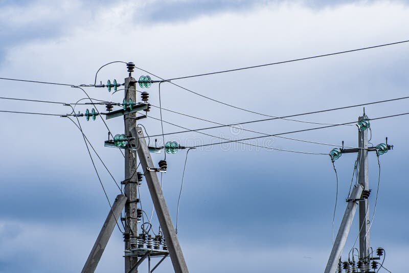 Power Poles of High Voltage Line on Cloudy Sky Background. Stock Image ...