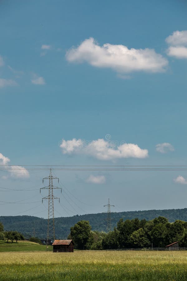 Power Pylon in the German Countryside with Forests, Fields and M Stock ...