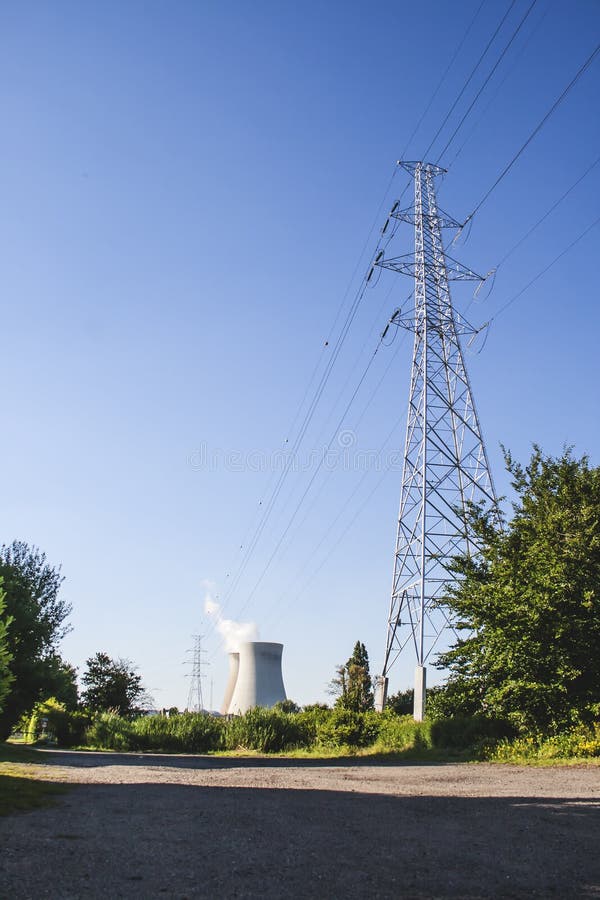 Power Pylons and Nuclear Chimneys Stock Photo - Image of clear, blue ...