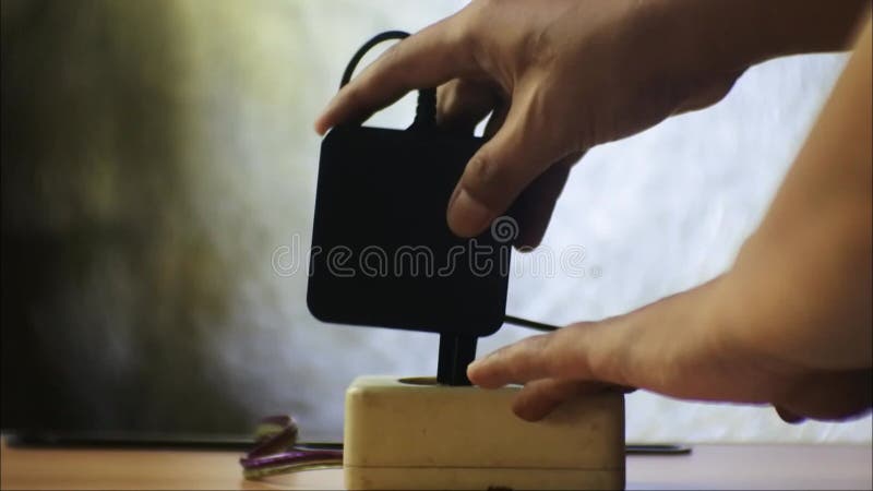 Power Saving or Cost Reduction Concept. Close-up of Male Asian Hand ...