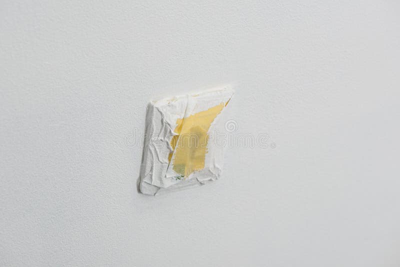 Power Socket Covered with Masking Tape while the White Wall Being ...