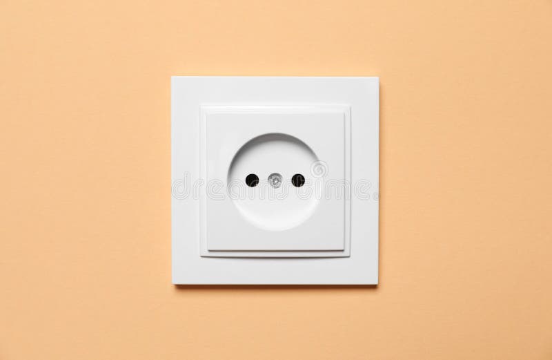 Power Socket on Pale Orange Wall. Electrical Supply Stock Photo - Image ...
