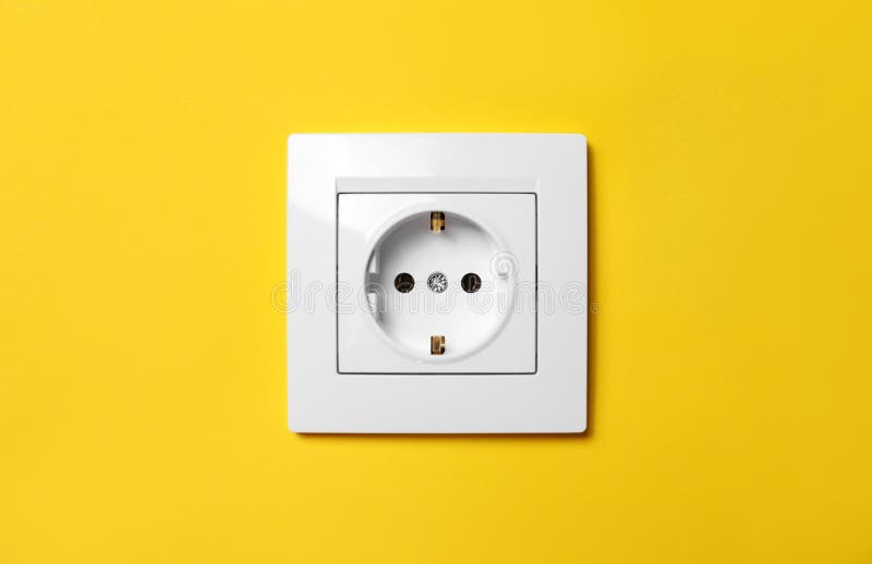 Power Socket on Yellow Wall. Electrical Supply Stock Photo - Image of ...