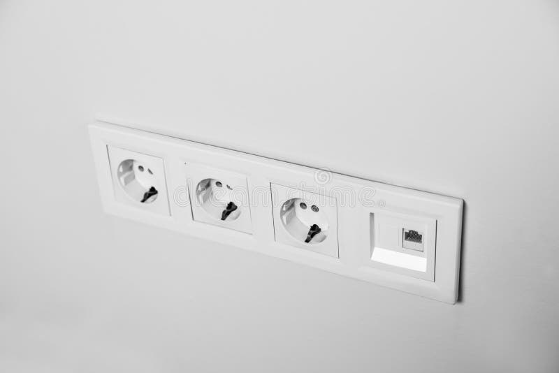 Power Sockets on White Wall, Closeup. Electrical Supply Stock Photo ...