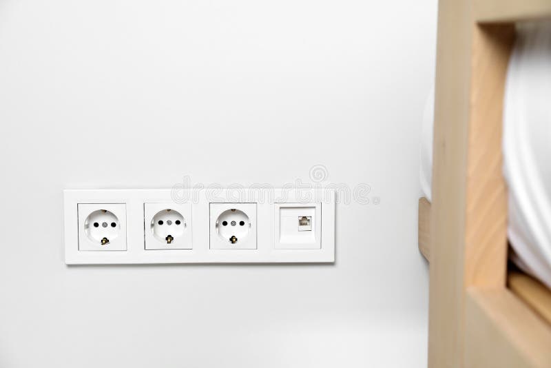 Power Sockets on White Wall Indoors. Electrical Supply Stock Photo ...