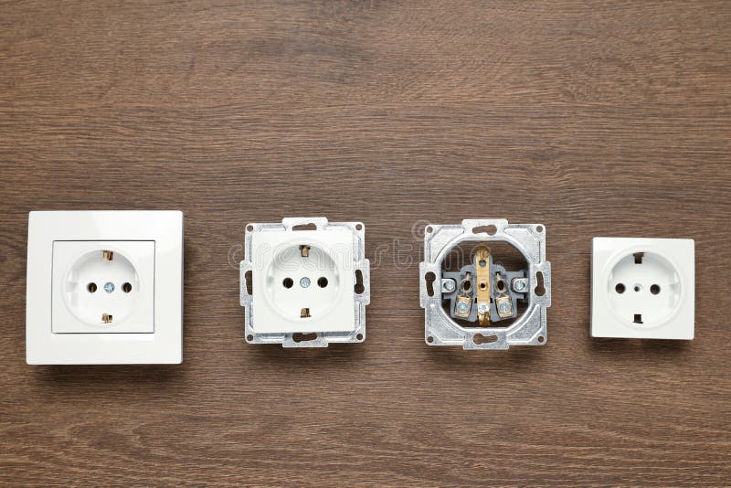 Power Sockets on Wooden Table, Flat Lay. Space for Text Stock Photo ...